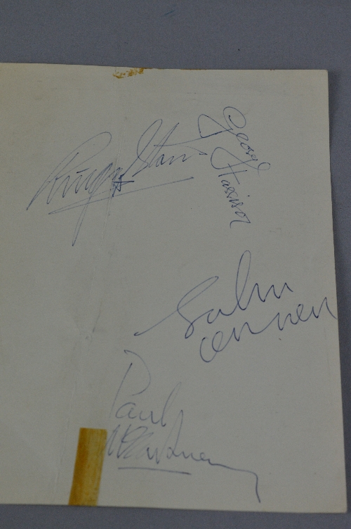 THE BEATLES AUTOGRAPHS, all four signatures in blue biro on the reverse ...