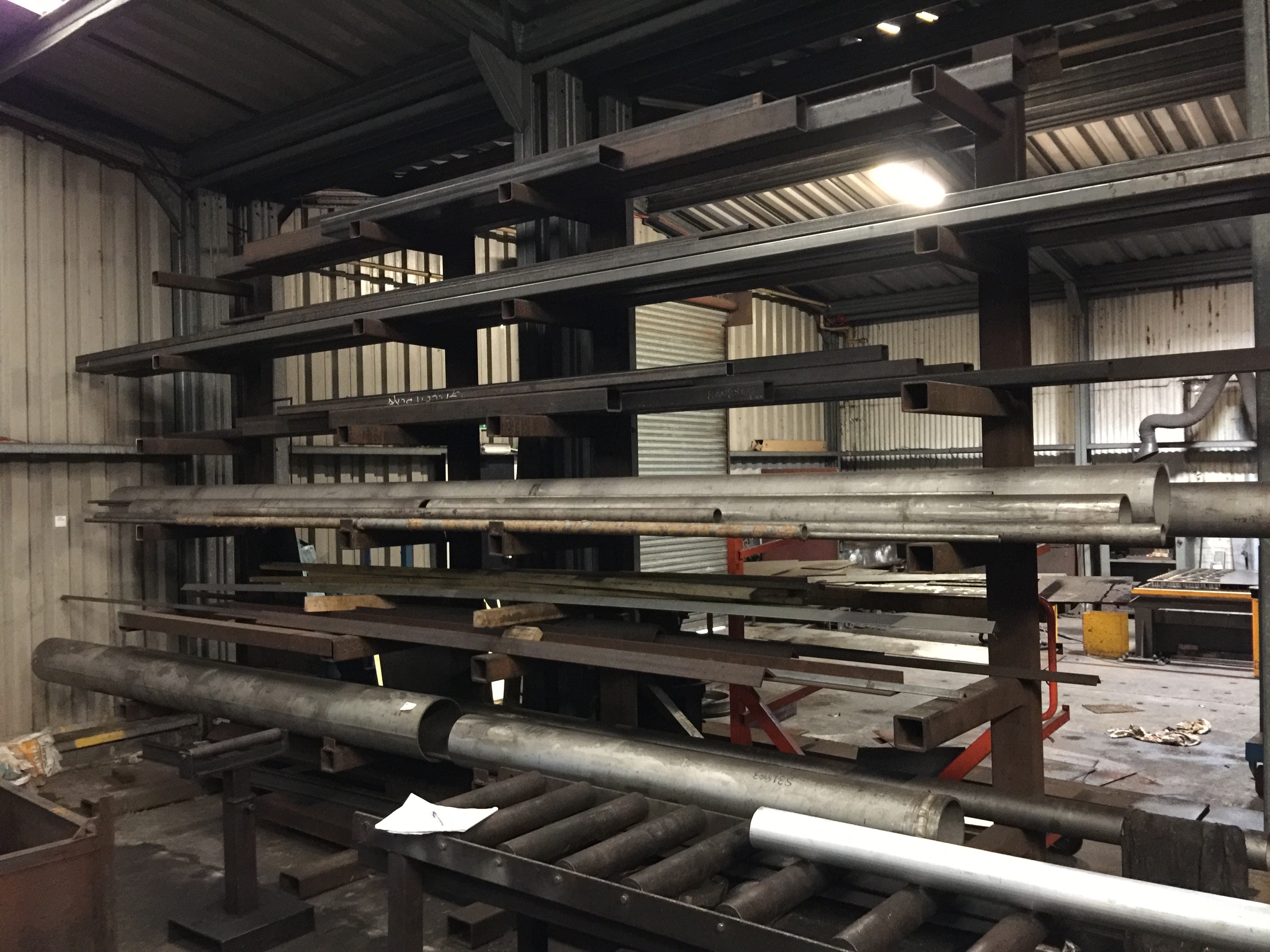 4 x Steel storage racks and contents - stocks of round bar, tube, flat ...