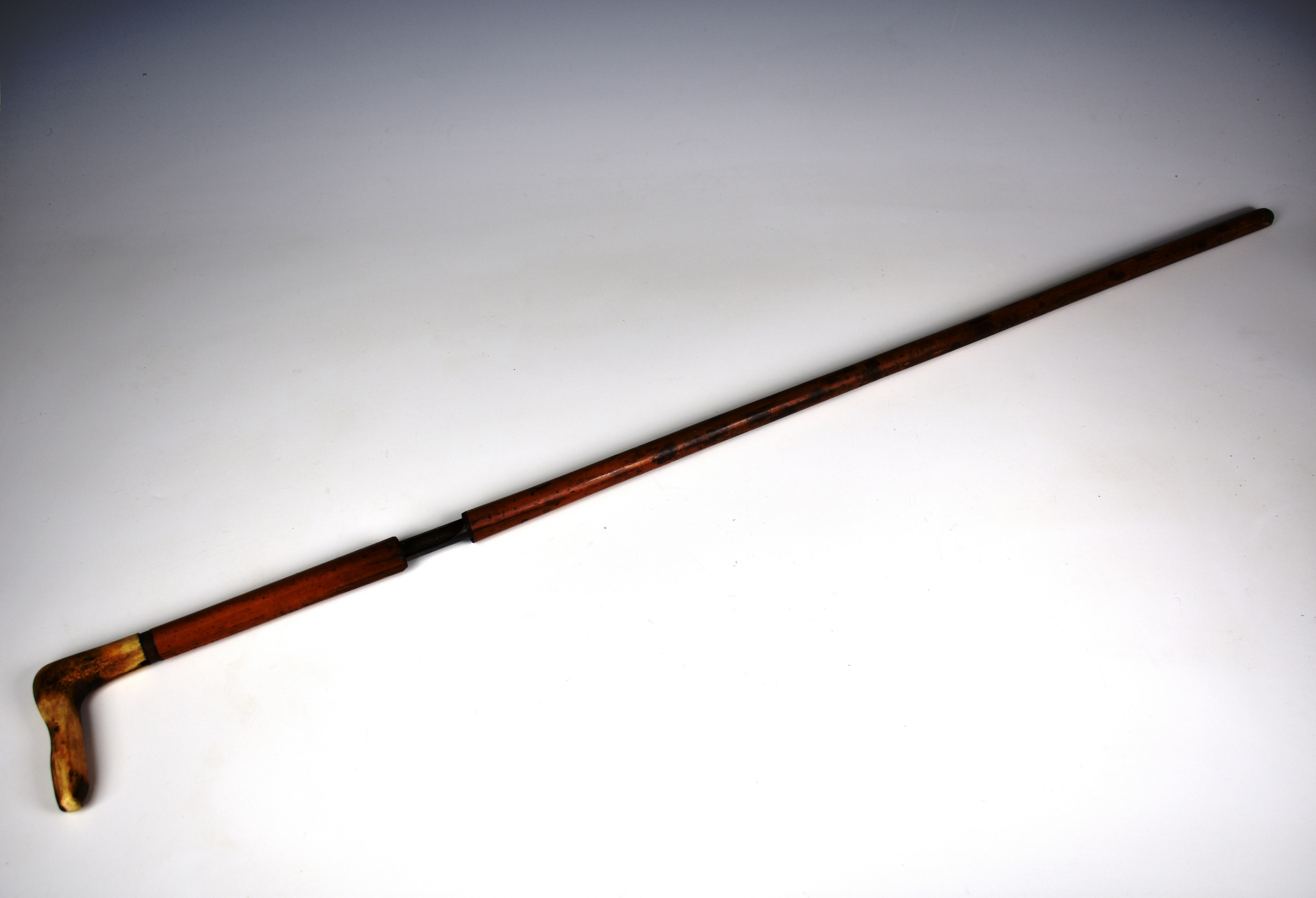 A late 19th century antler mounted and malacca covered steel gun stick ...
