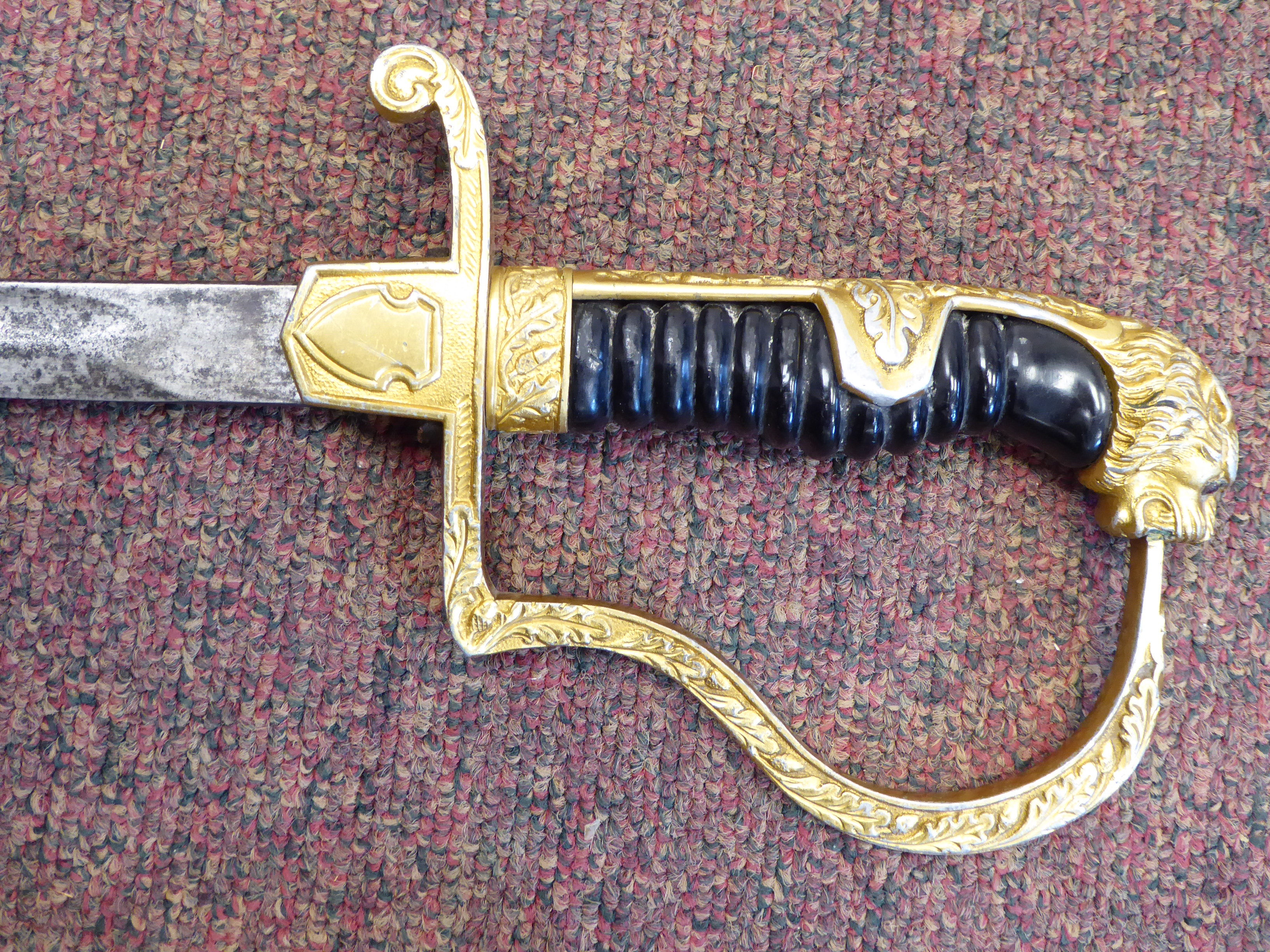 A German World War II Third Reich Army sabre with a ribbed black ...