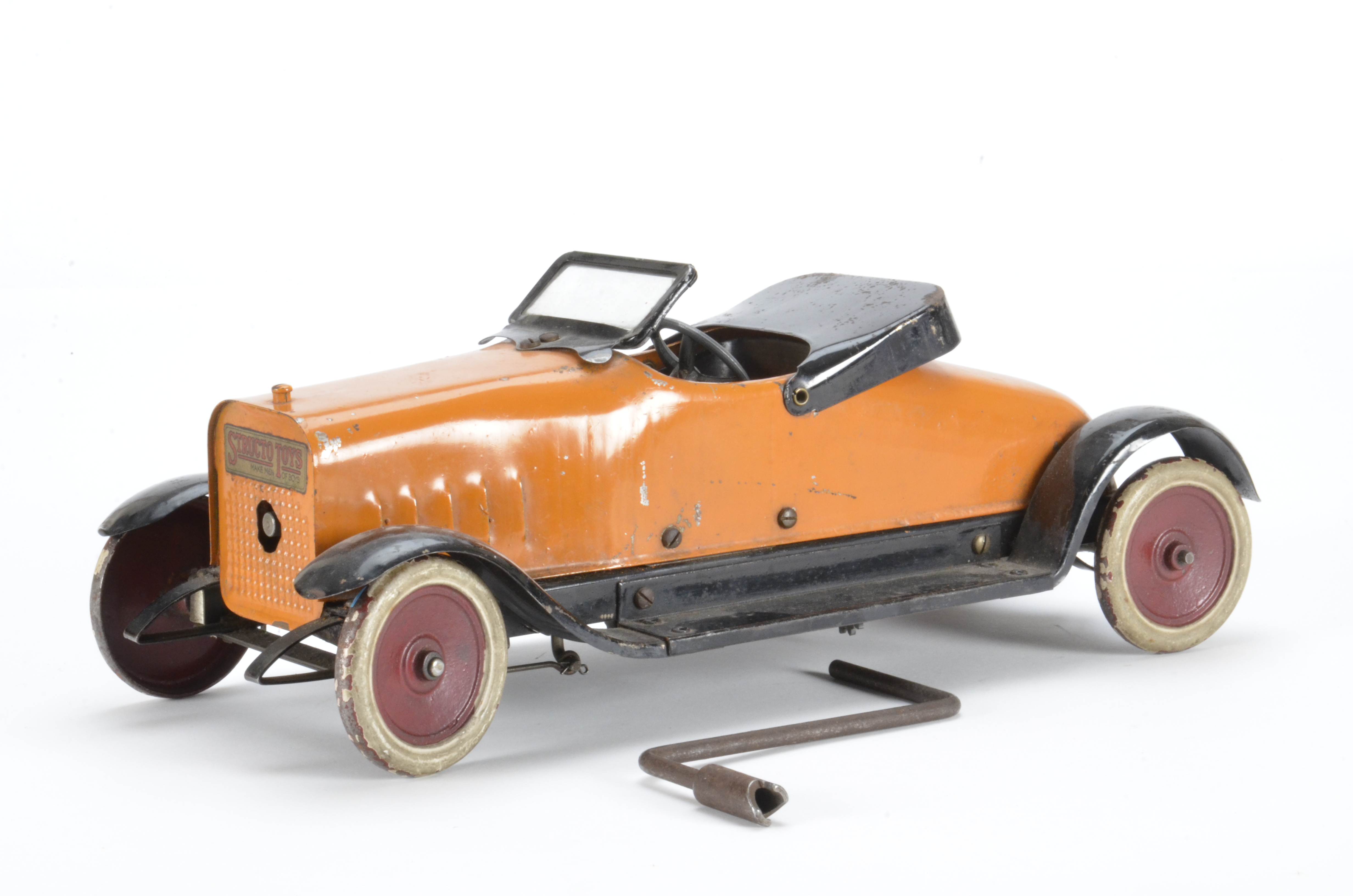 A Structo Toys Pressed Steel and Tinplate clockwork two seater Car, in ...