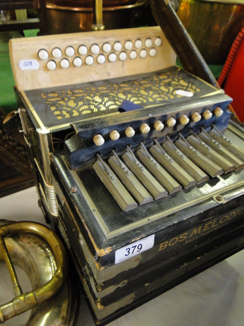 A Melodeon 3 stops, labelled Bos Melodian, made in Germany, and one ...