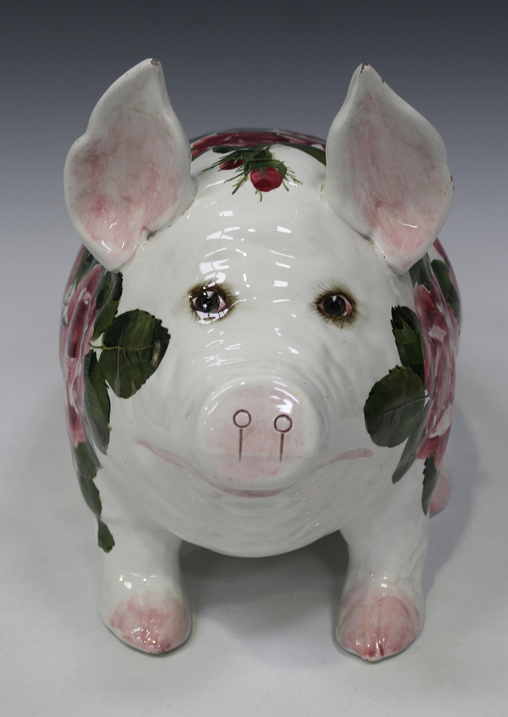 A large Wemyss pottery pig, modelled seated on its haunches, painted ...