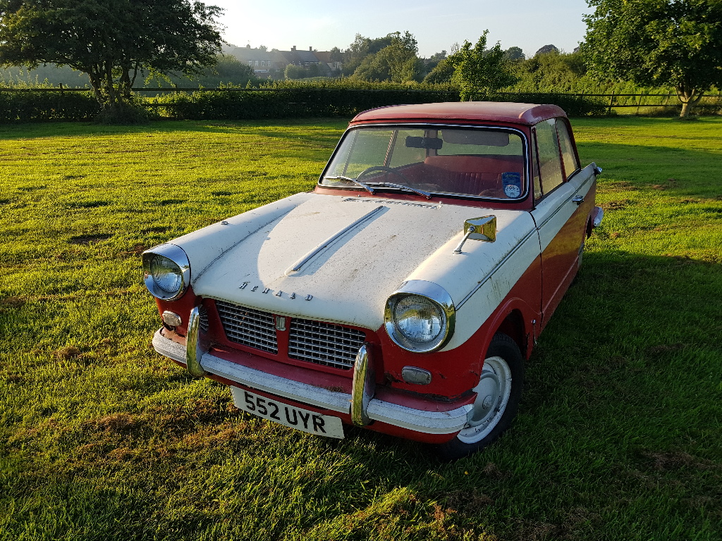 A 1962 Triumph Herald 1200, registration number 552 UYR, red and white ...