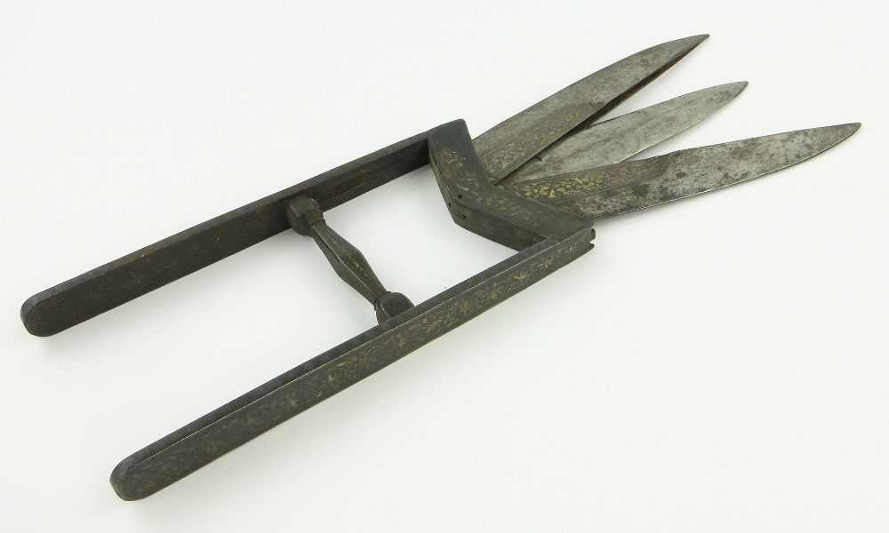 An Antique steel Qatar knife, with folding blade guards and Damascened ...
