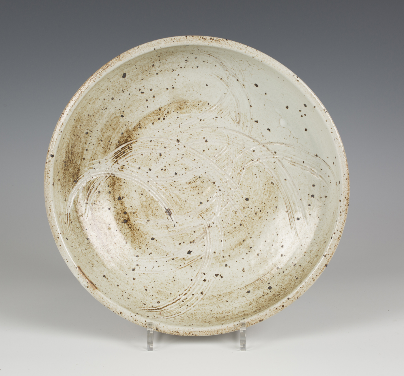 A Peter Lane studio pottery bowl, decorated in an oatmeal glaze over ...