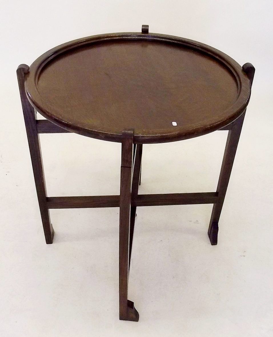 A "Revertable" circular folding card table with reversible top