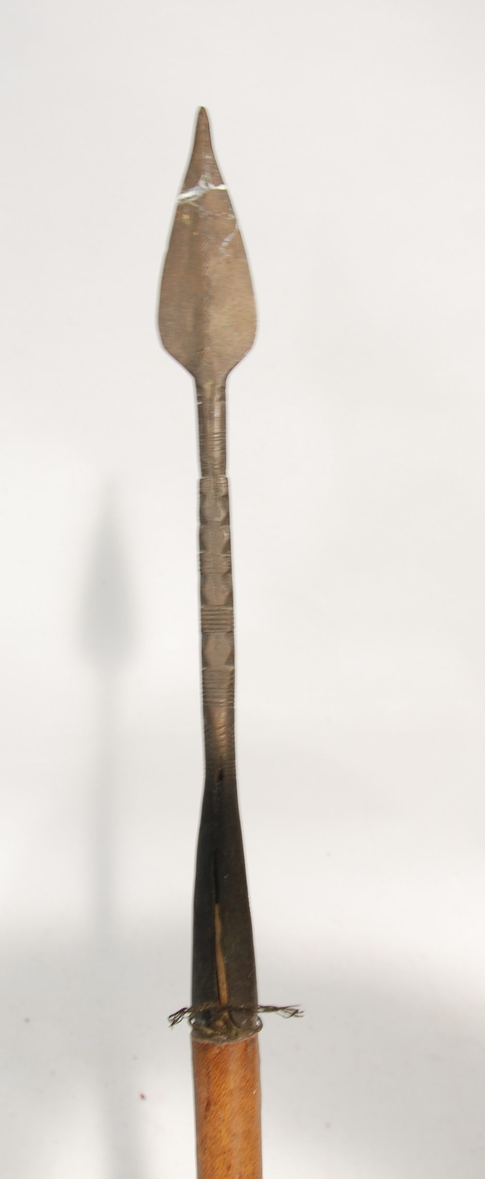 PROBABLY AFRICAN, CEREMONIAL SPEAR with engraved bronze leaf shaped ...