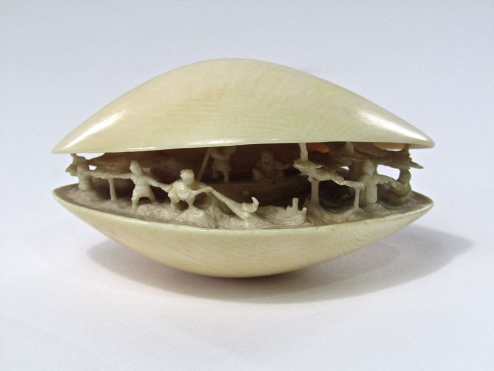 19th century Japanese ivory clam shell, the interior carved with ...
