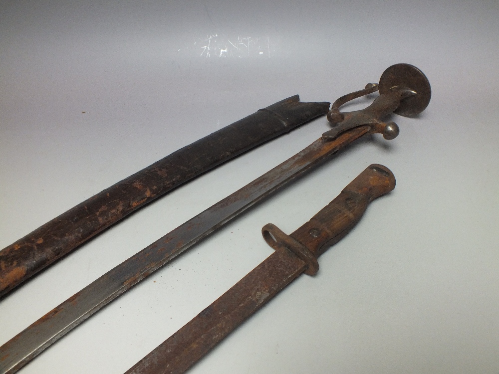 A MIDDLE EASTERN CURVED SWORD, with shaped metal grip, overall L 86.5 ...