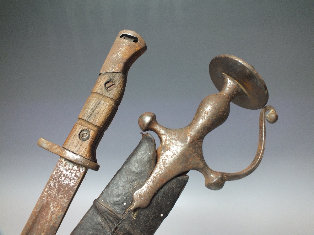 A MIDDLE EASTERN CURVED SWORD, with shaped metal grip, overall L 86.5 ...