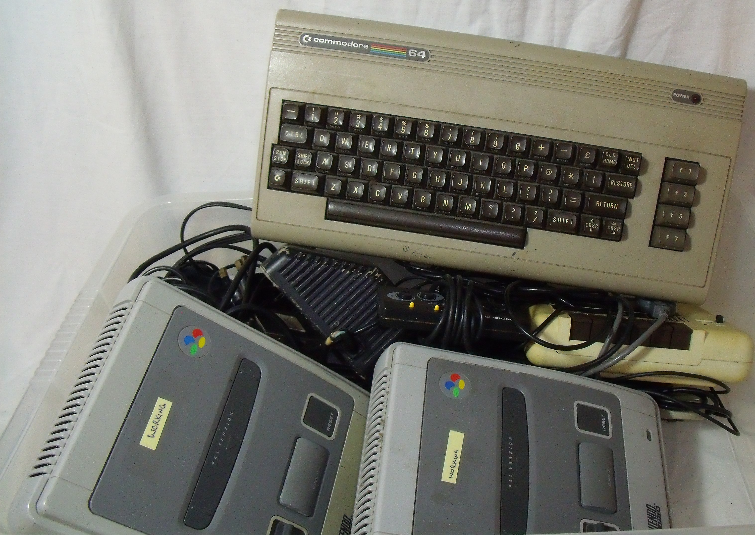 Commodore 64 games console and tape deck, two Super Nintendo game ...