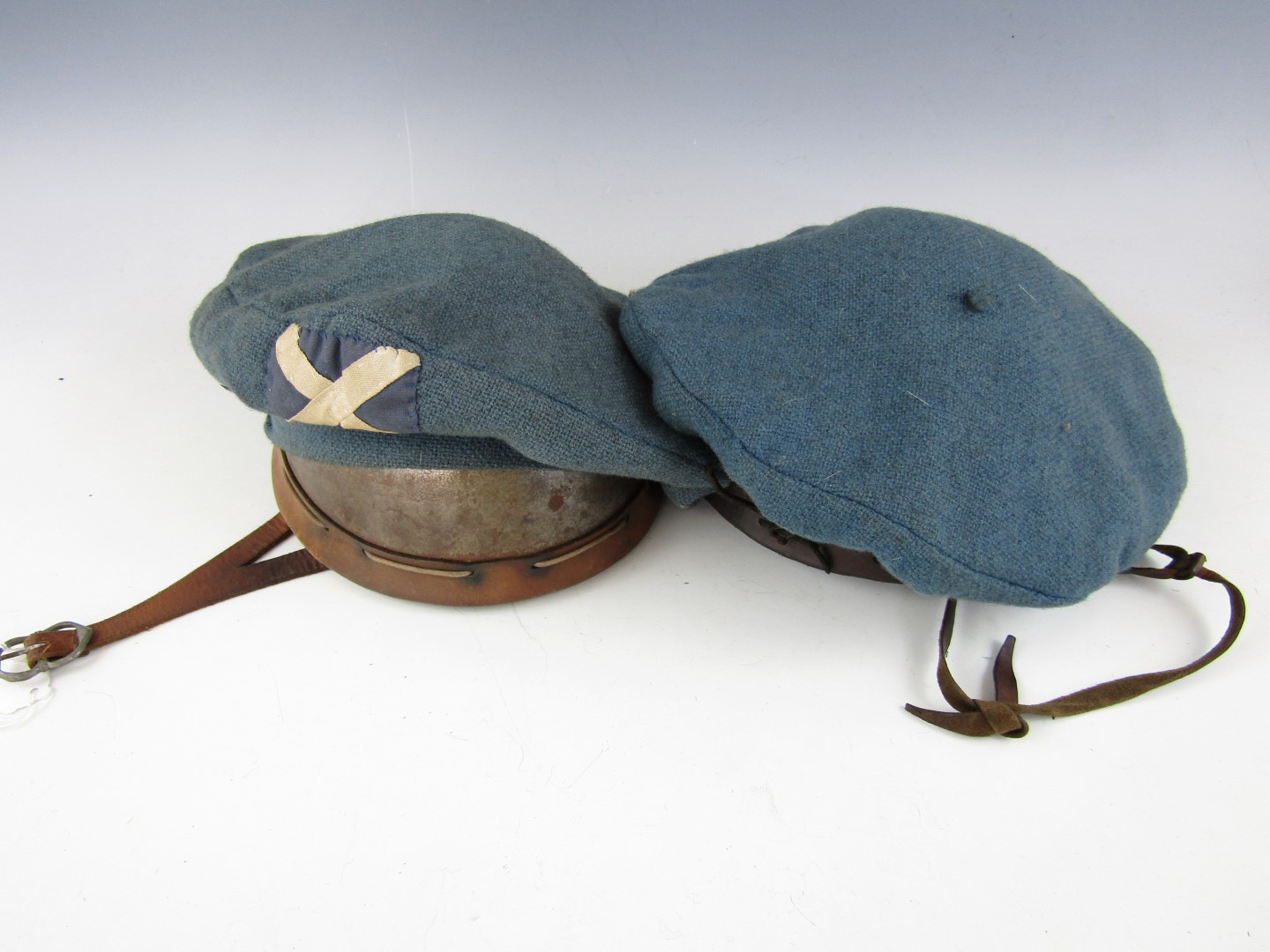 A reproduction Jacobite Baggot's Hussars bonnet together with a blue bonnet