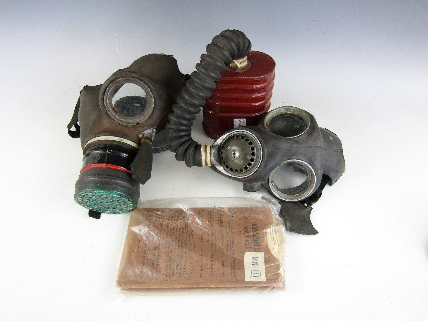 A WWII General Service respirator, a Civilian Duty gas mask and anti ...