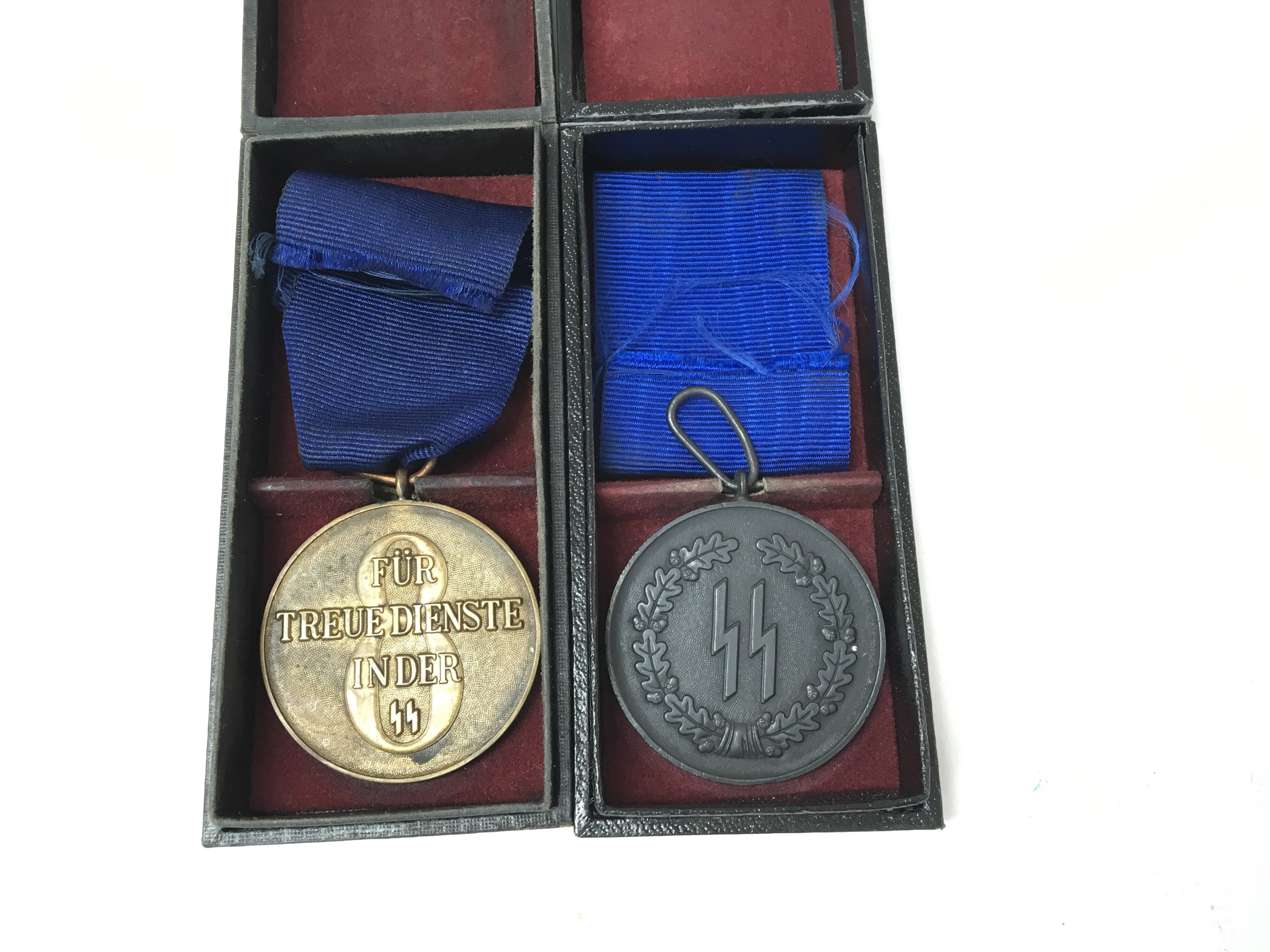 A pair of a German WW2 SS medals including a 4 years service and 8 ...