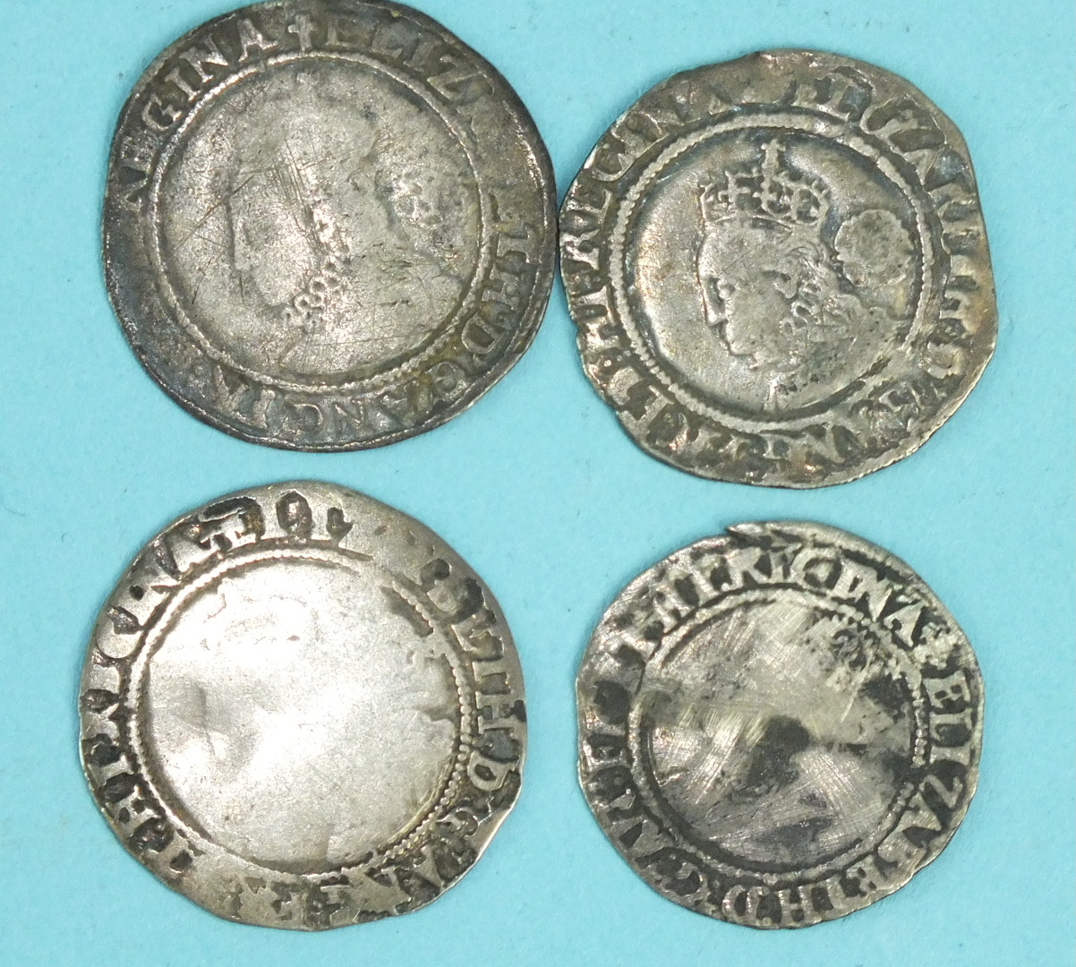 A collection of four Queen Elizabeth I silver hammered coins, including ...