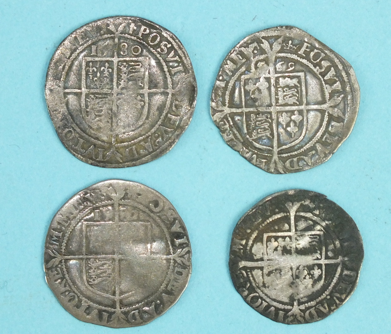 A collection of four Queen Elizabeth I silver hammered coins, including ...