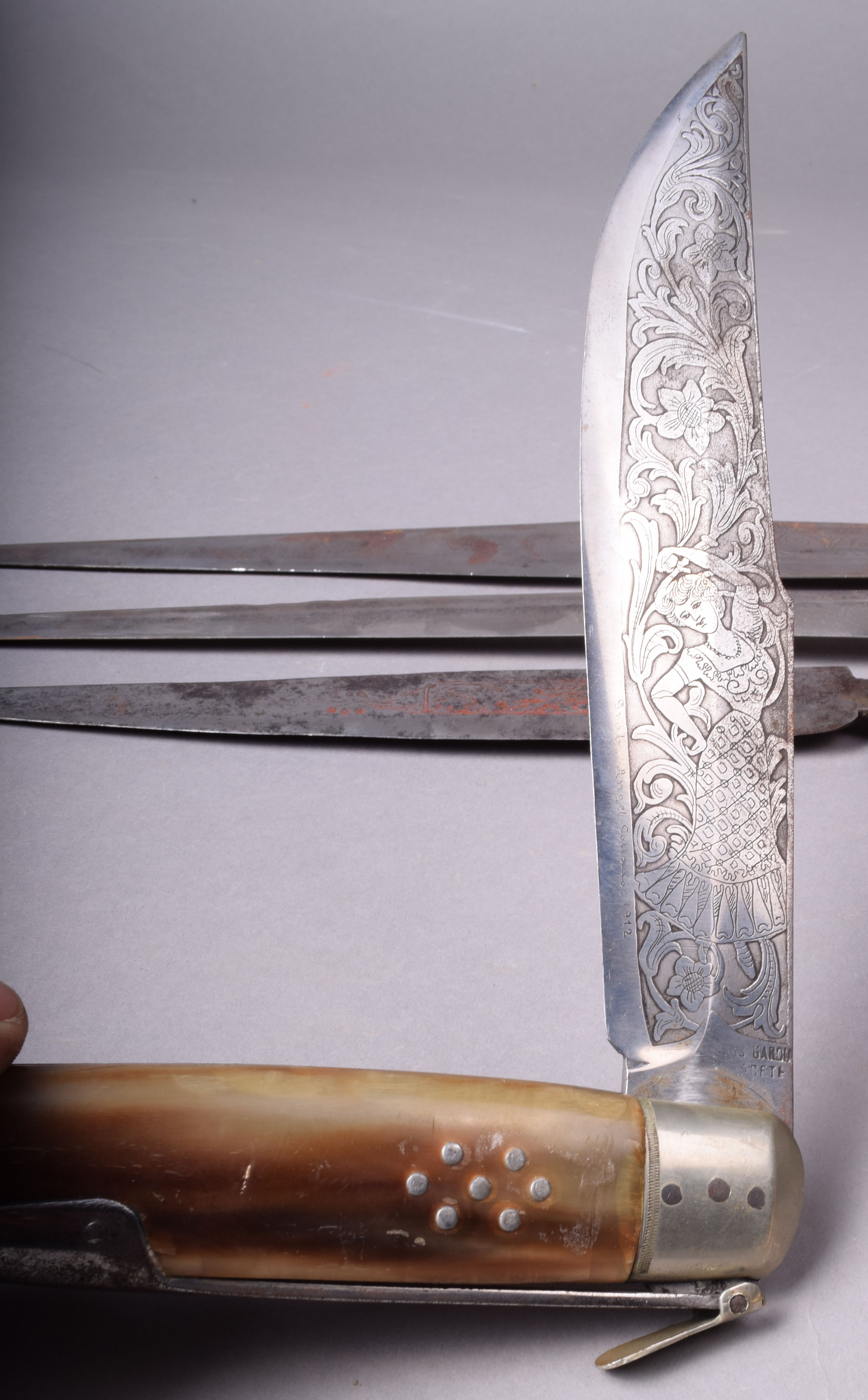 A Spanish navaja folding knife, with an etched blade decorated a ...