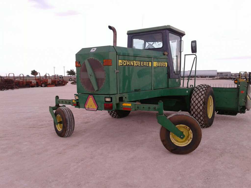 John Deere 4890 Swather with an 890 power reverse hay header, Shows ...