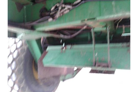 John Deere 4890 Swather with an 890 power reverse hay header, Shows ...