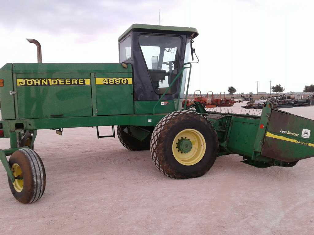 John Deere 4890 Swather with an 890 power reverse hay header, Shows ...