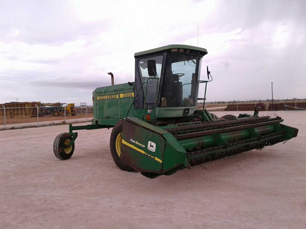 John Deere 4890 Swather with an 890 power reverse hay header, Shows ...