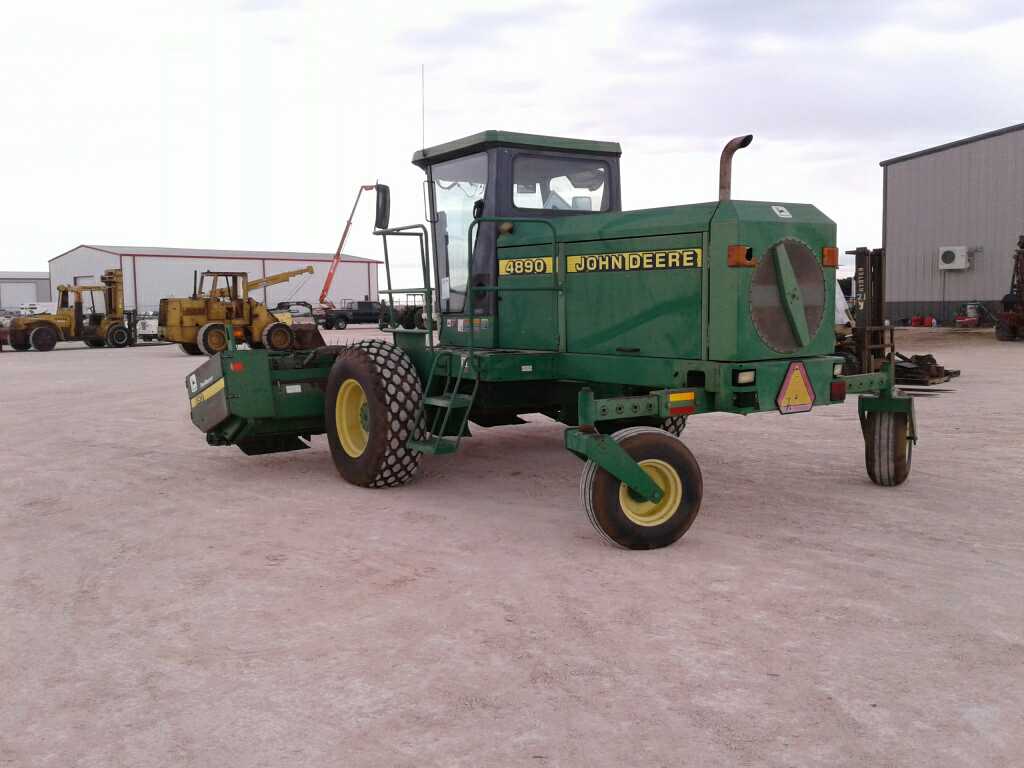 John Deere 4890 Swather with an 890 power reverse hay header, Shows ...