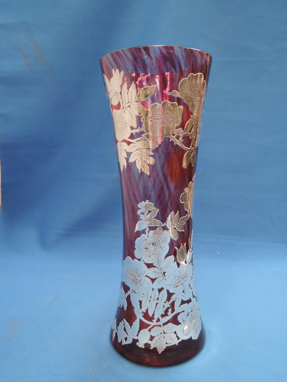 A 20th century glass vase by Laugharne having pink mottled ground and ...
