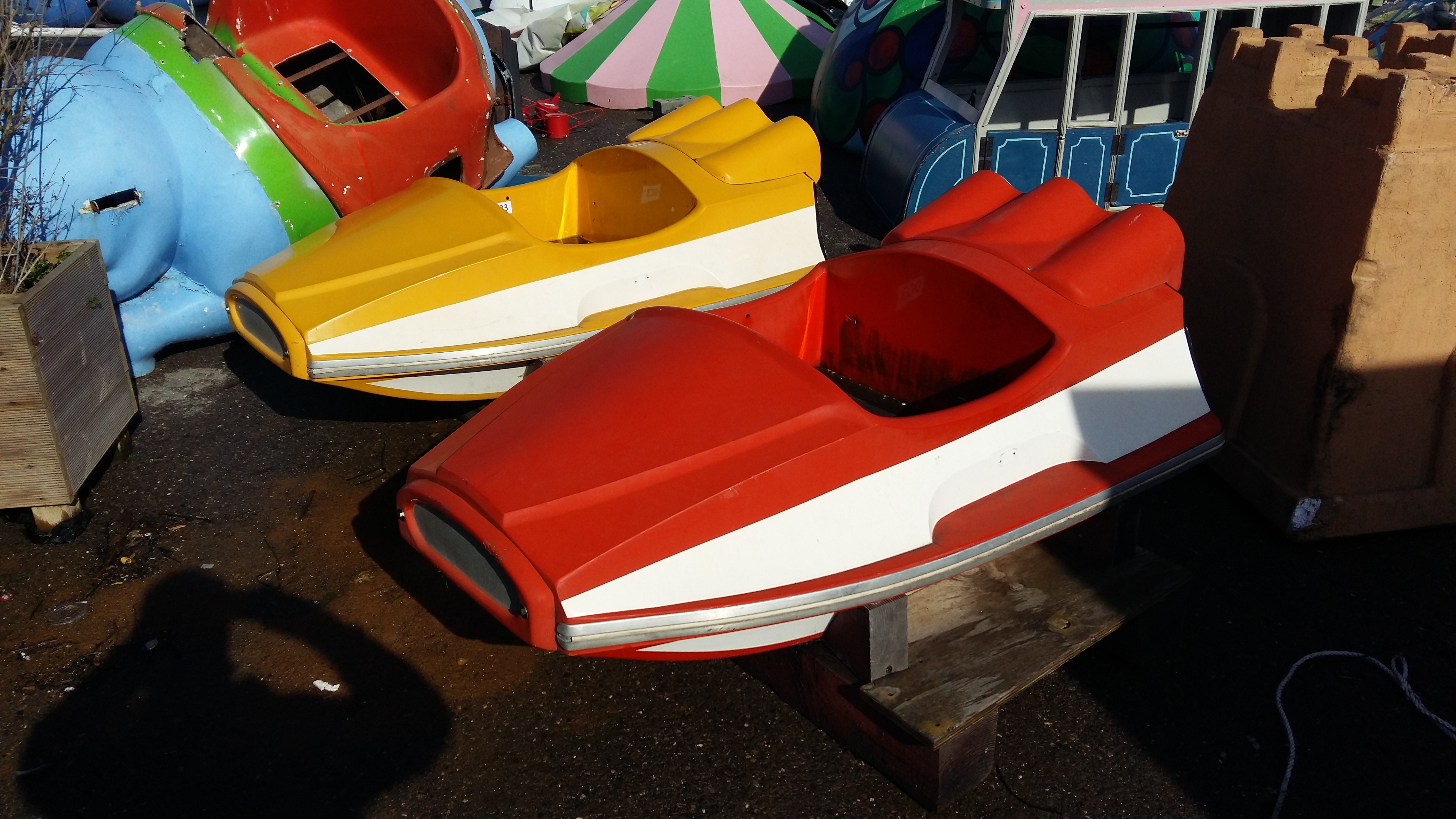 (2) Fibreglass 'Rocket' ride cartsSingle position carts(1) Red and ...