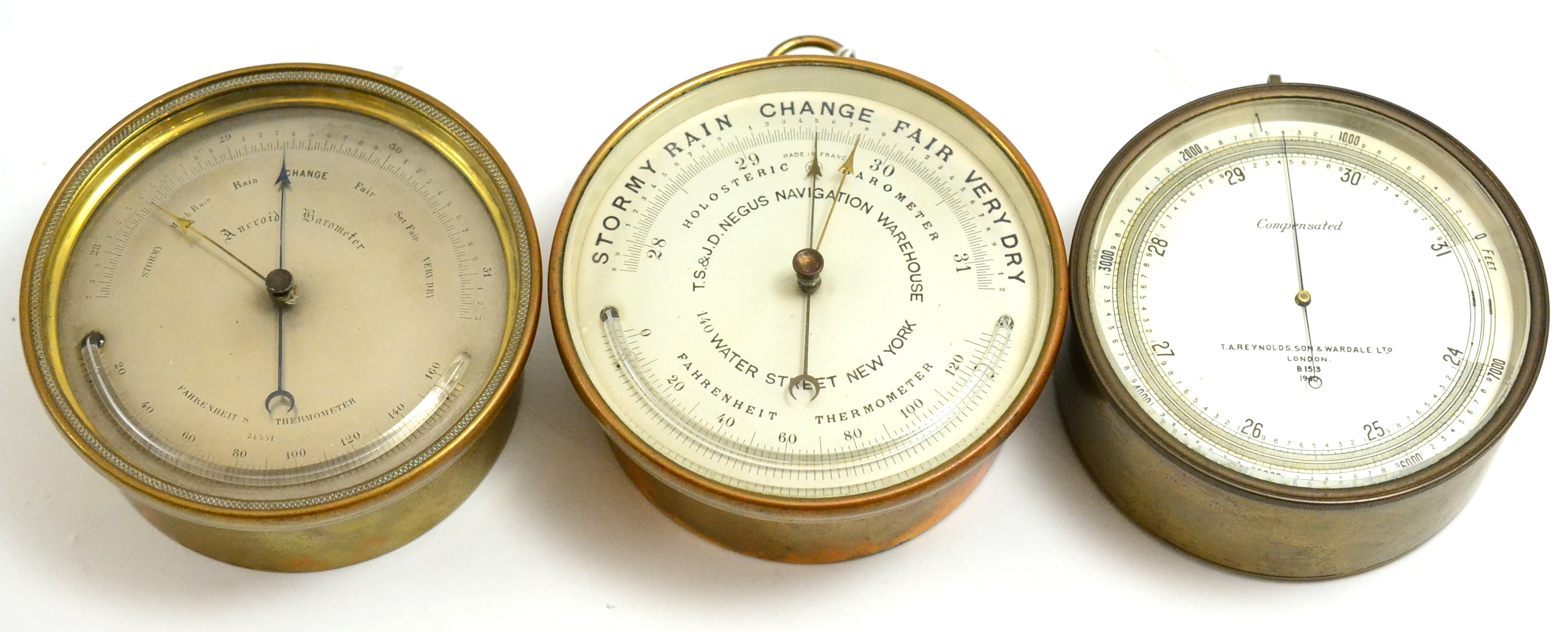 Three brass cased aneroid barometers, 4-1/2-inch silvered dial signed ...