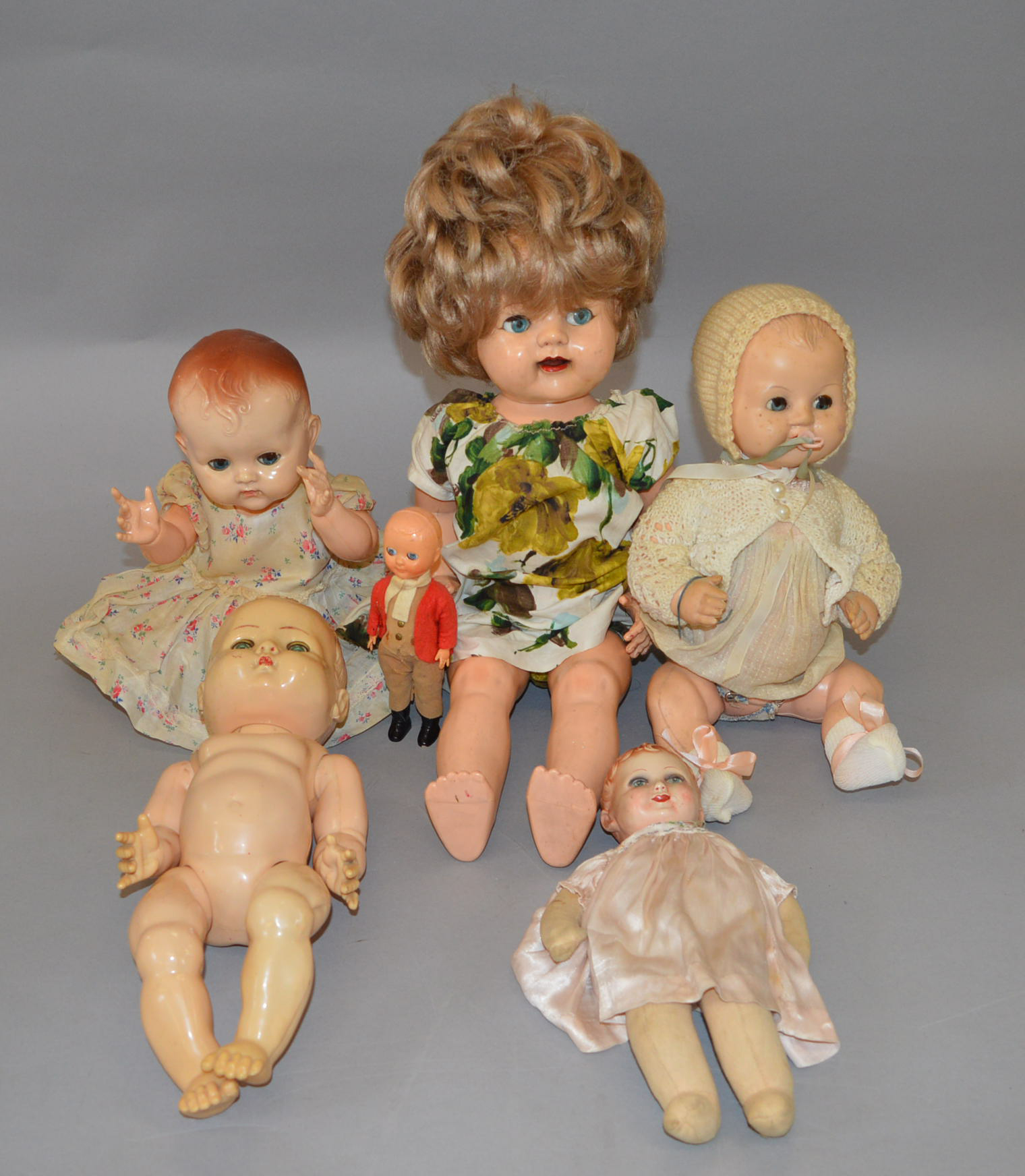 Six unboxed vintage dolls, including a 21 inch plastic doll marked ...