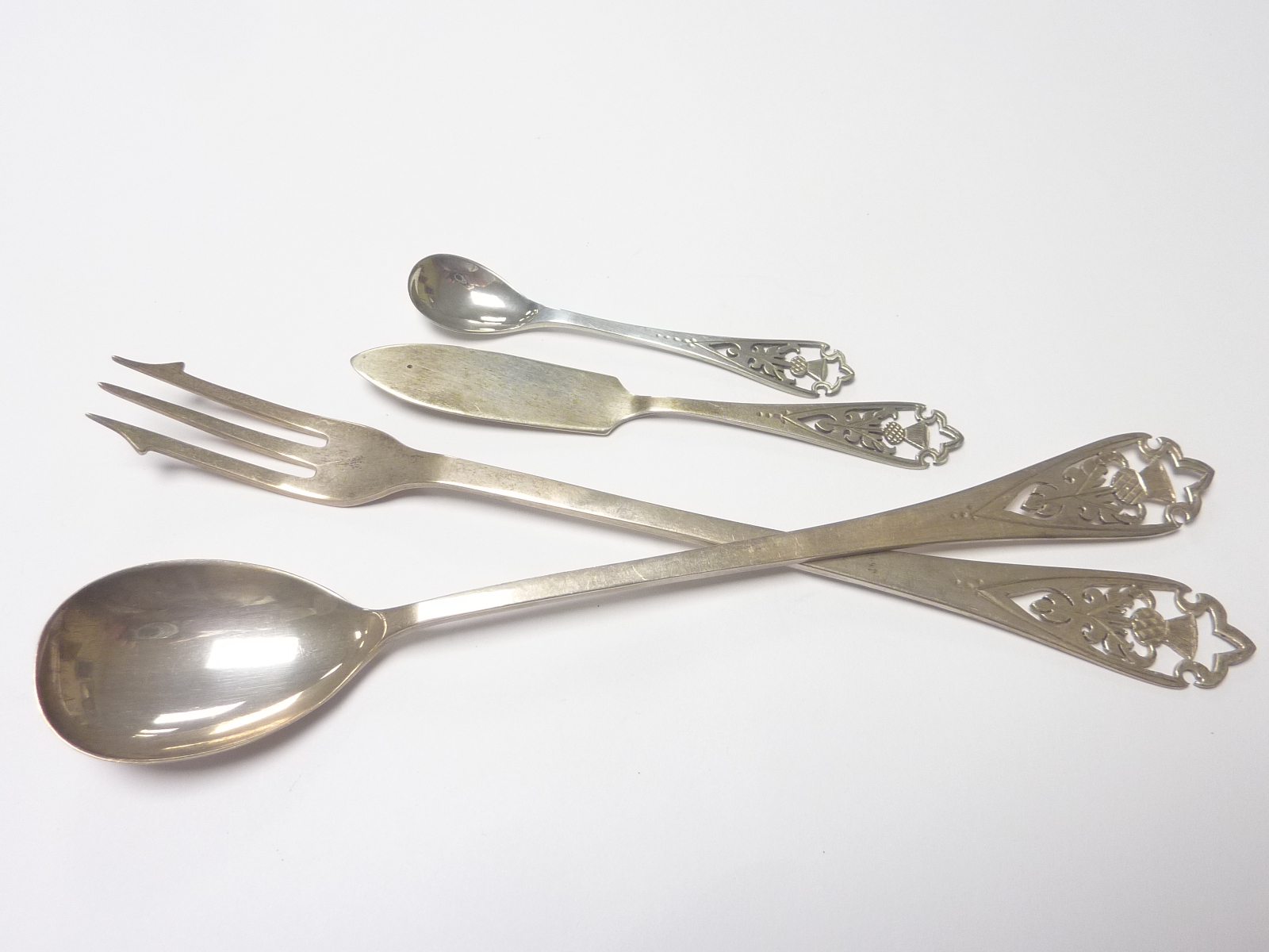 Silver pickle spoon and fork with pierced thistles and a single mustard ...