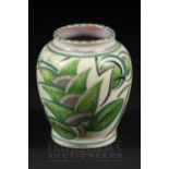 A pair of Compton Pottery bookends in the form of St George and the ...