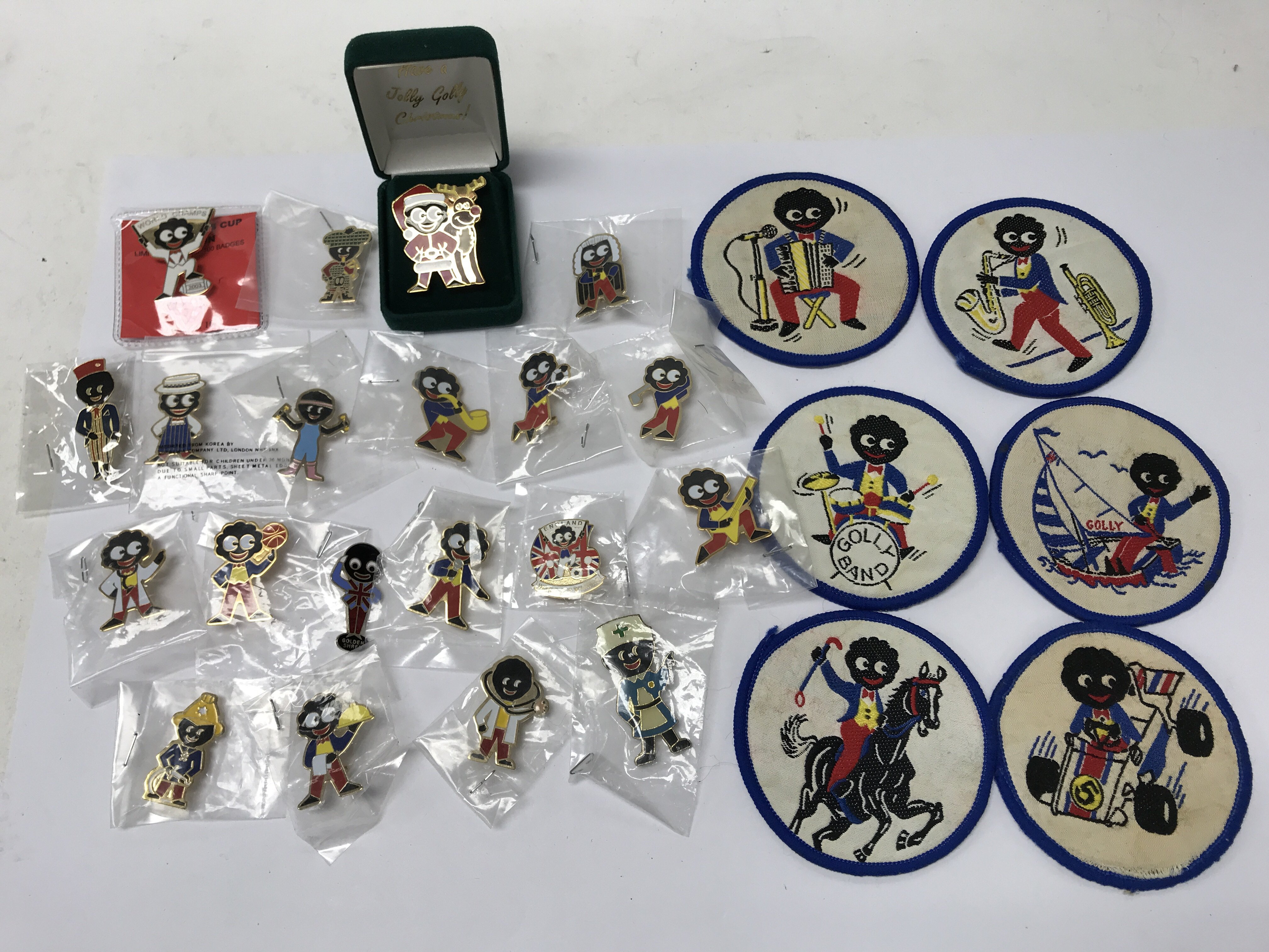 A large collection of Robertson's Golly badges and associated ...