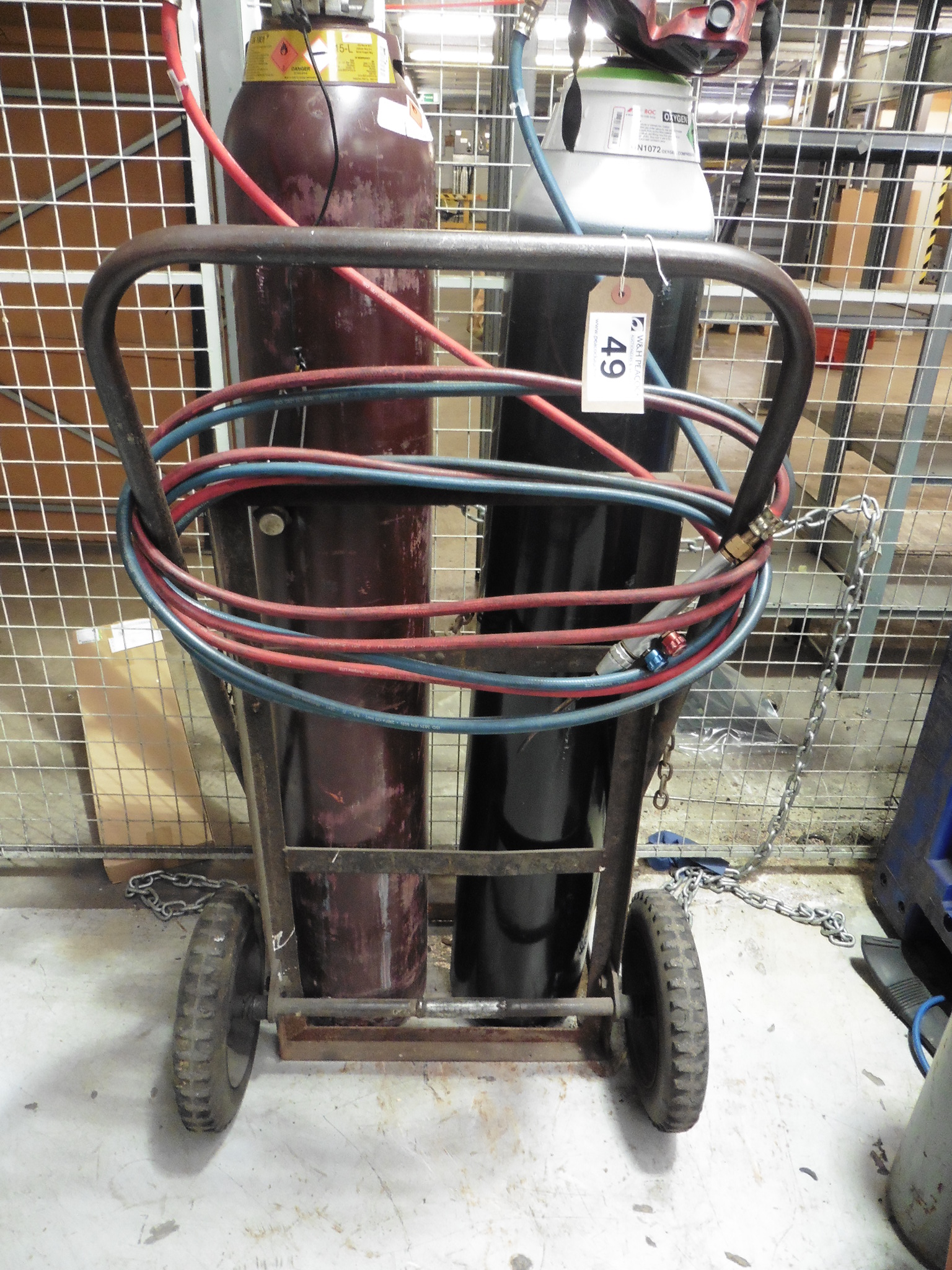 Set of oxy acetylene welding gear on trolley (bottles excluded)