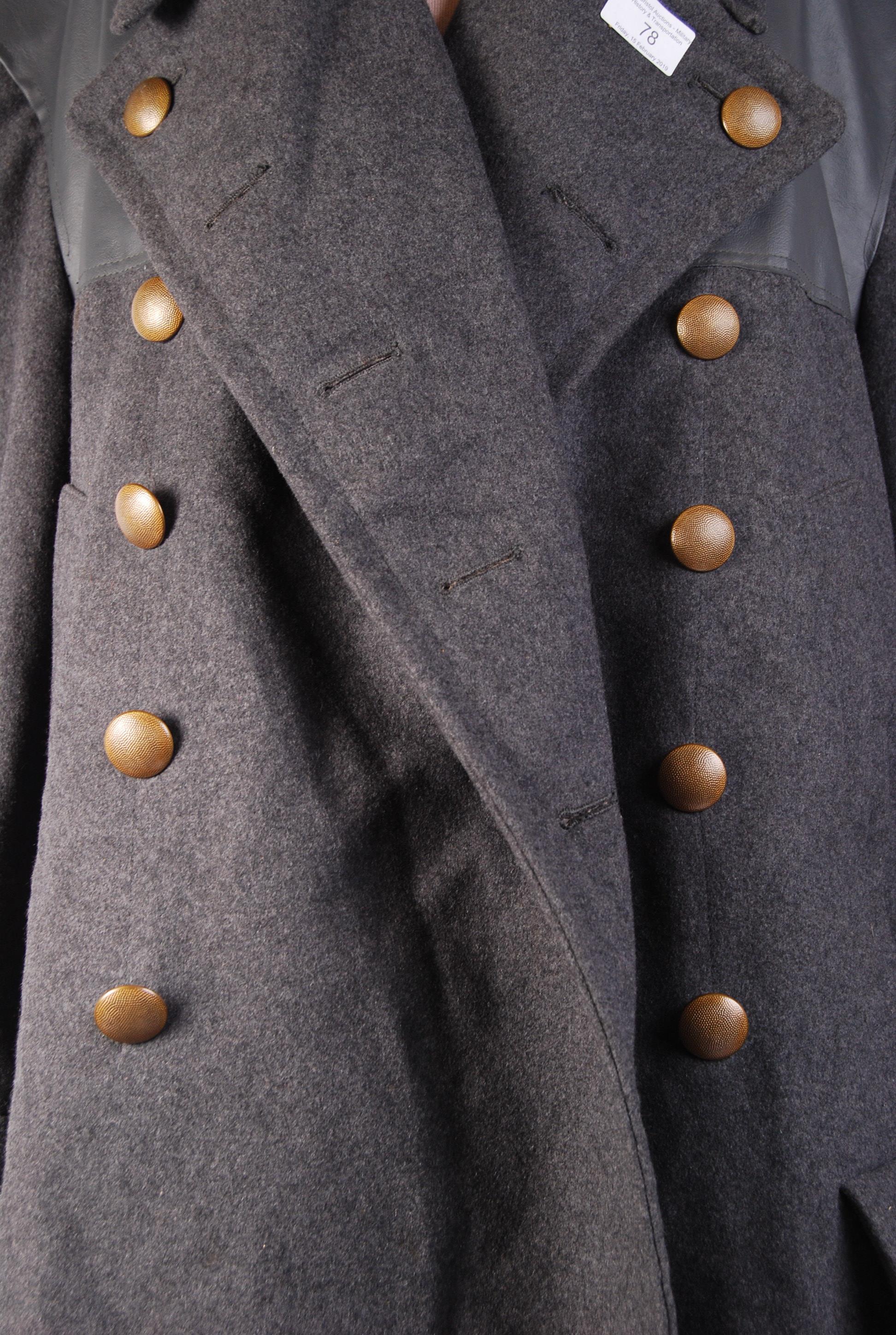 A post war military issue German great coat in grey wool with grey faux ...