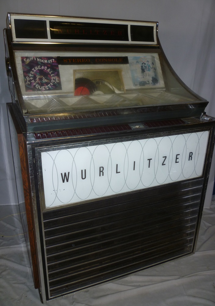 A 1970`s Wurlitzer 3000 stereo console jukebox in chrome and glazed case (working, but amp and se