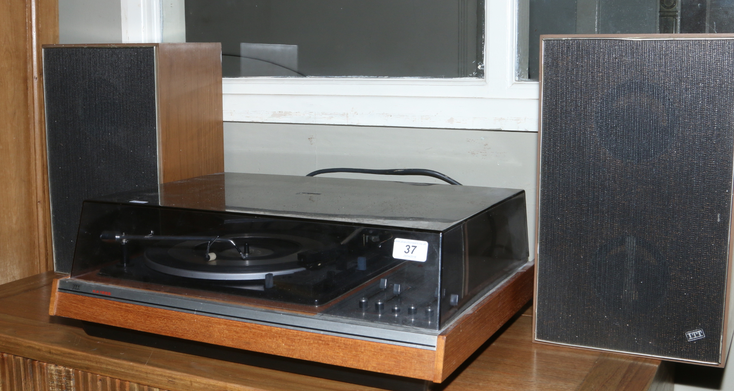 A 1970s teak cased twelve - fifty - five stereo system with ITT speakers.