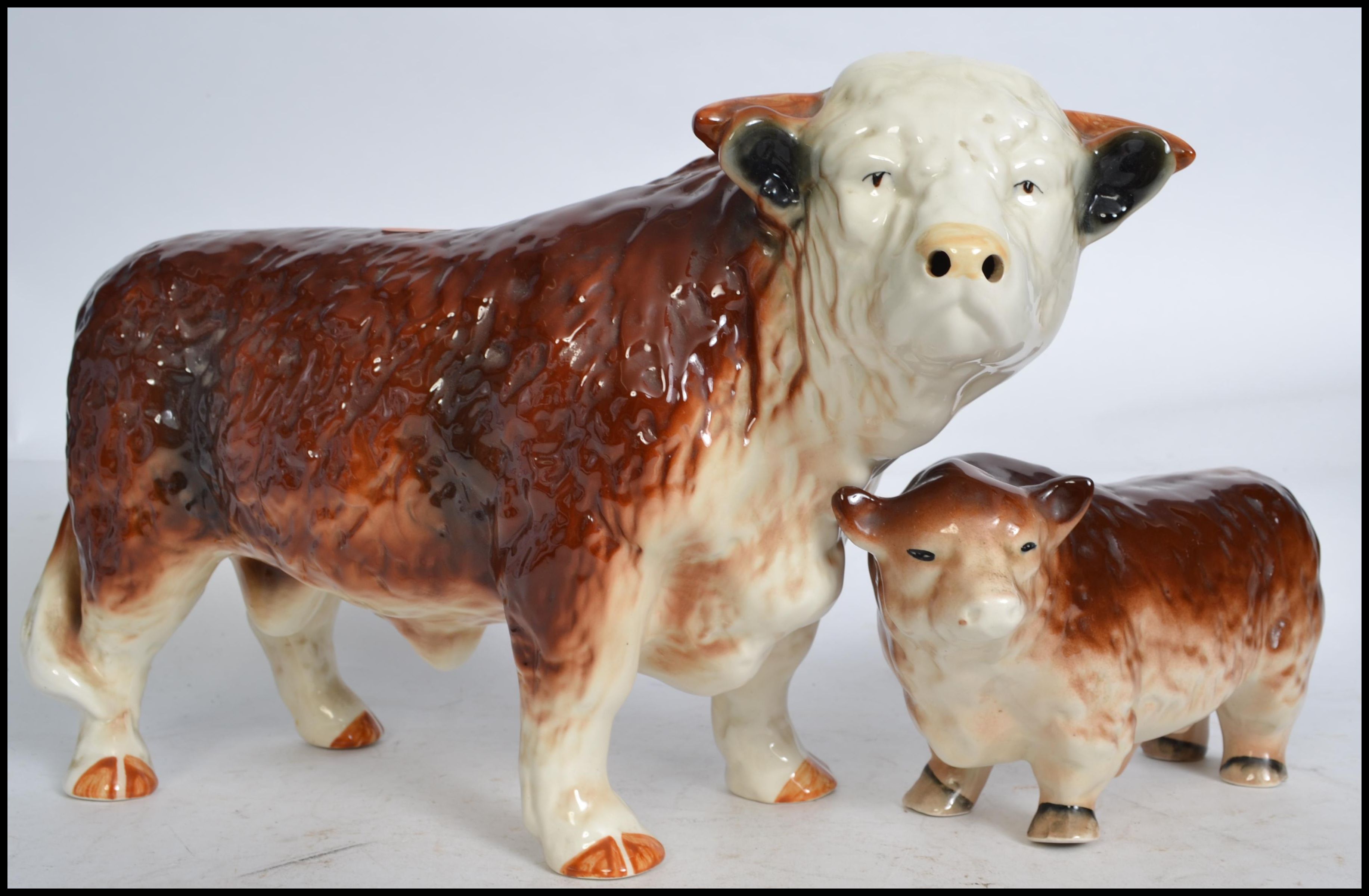 A large vintage 20th century ceramic Hereford Bull standing in usual ...