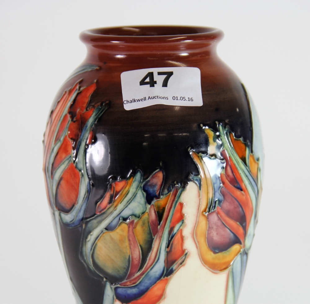 A Moorcroft pottery 'Tulip' design tall vase, H. 28cm. Excellent condition.