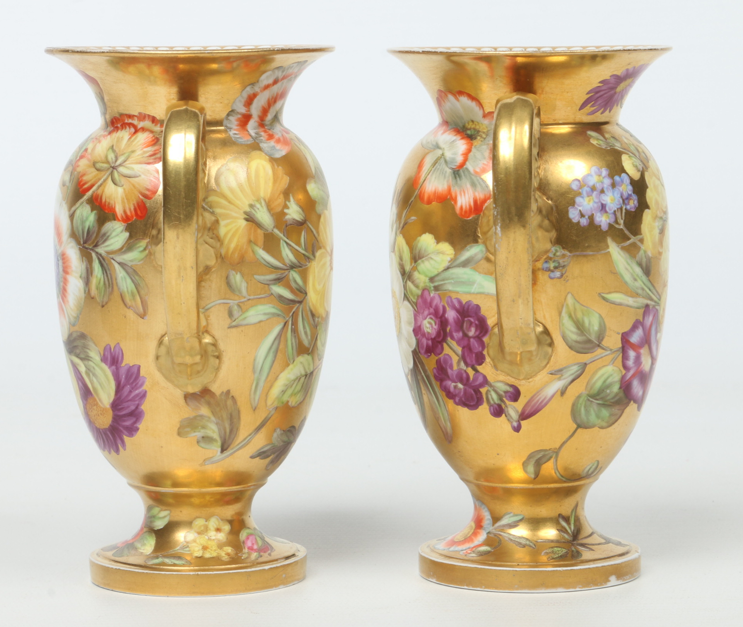 A rare pair of Spode twin handled vases. Gilt ground and enamelled all ...