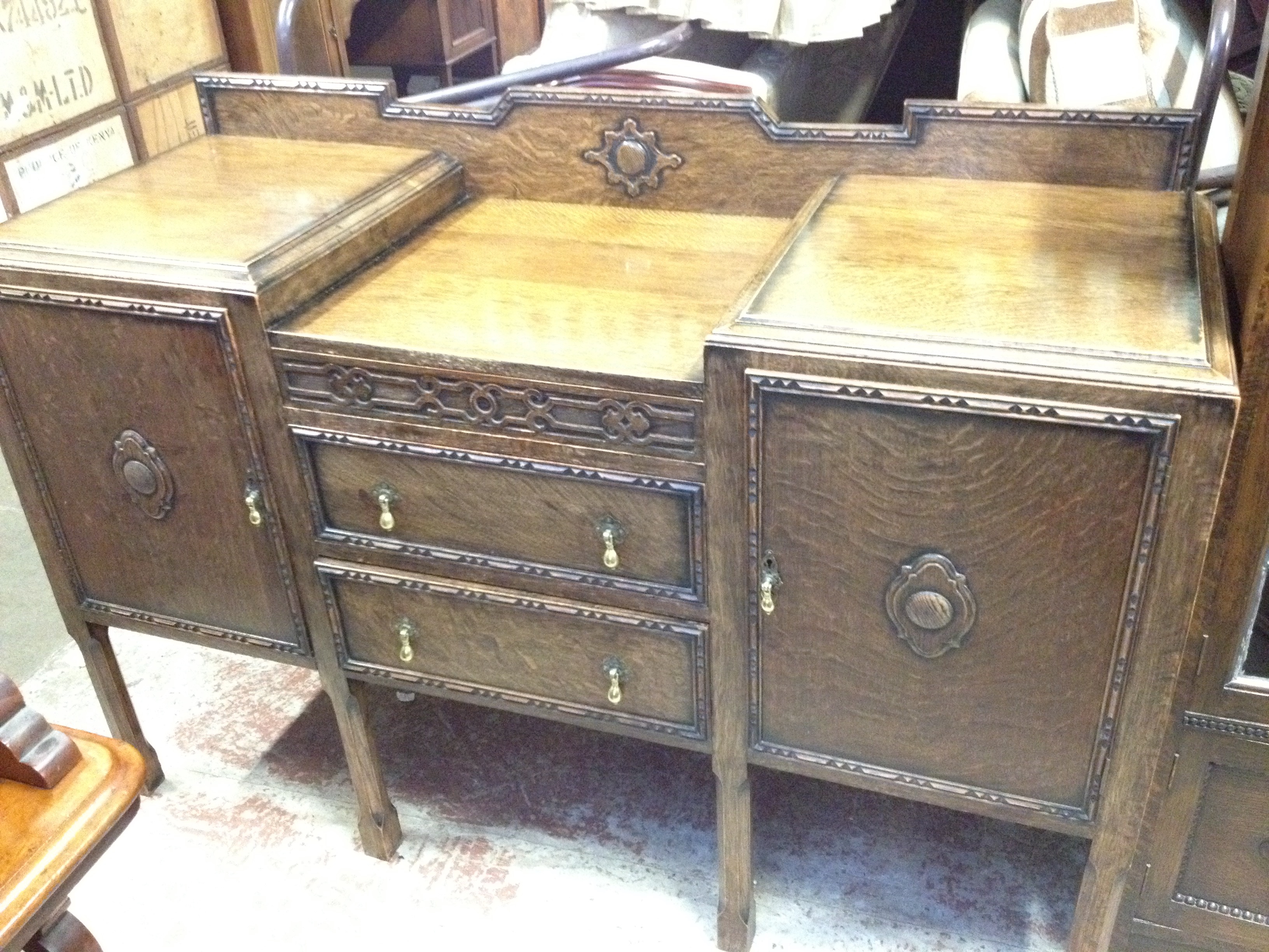 A 1920s oak sideboard