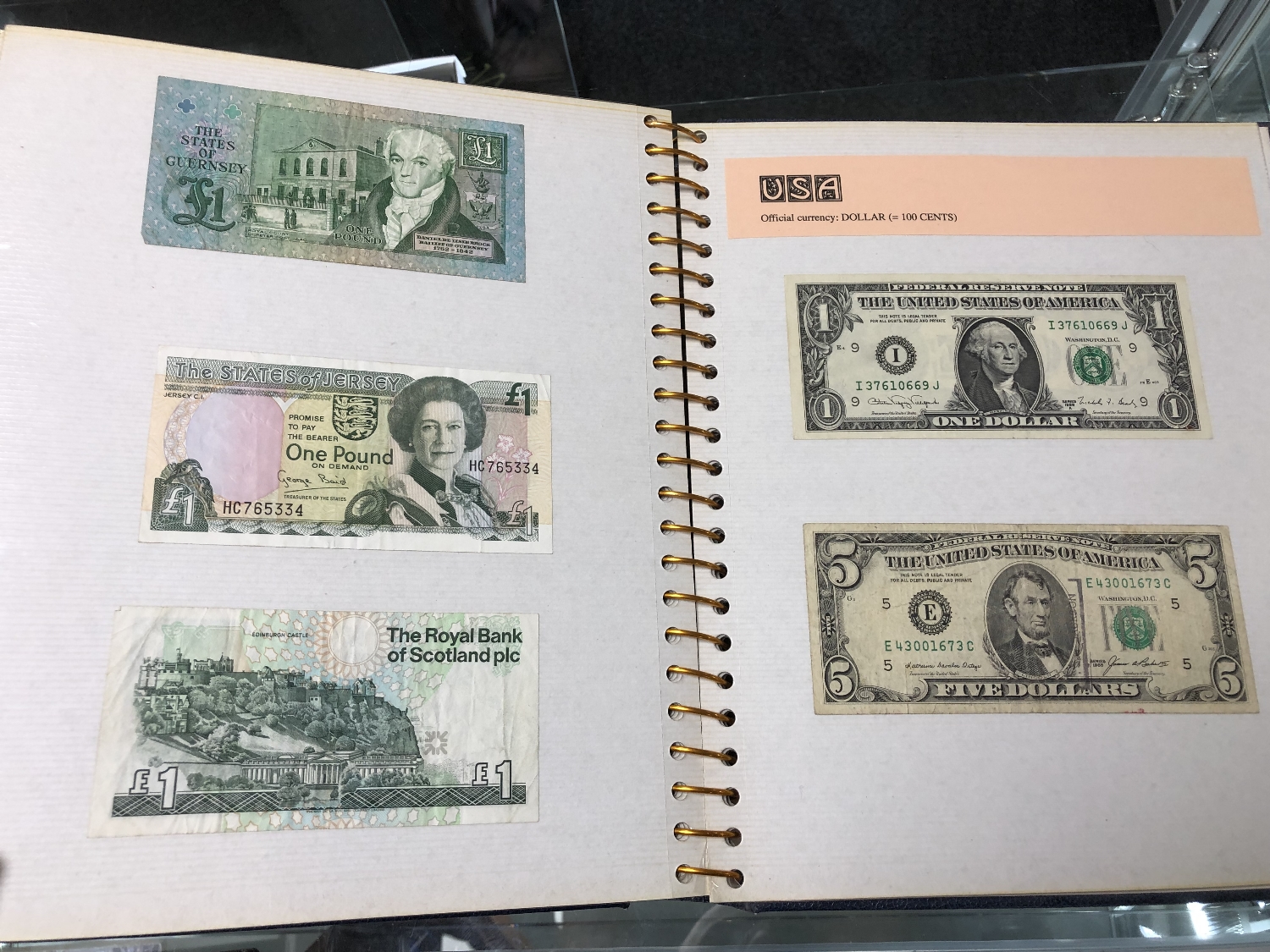 An International Currency Collection album containing banknotes of the ...