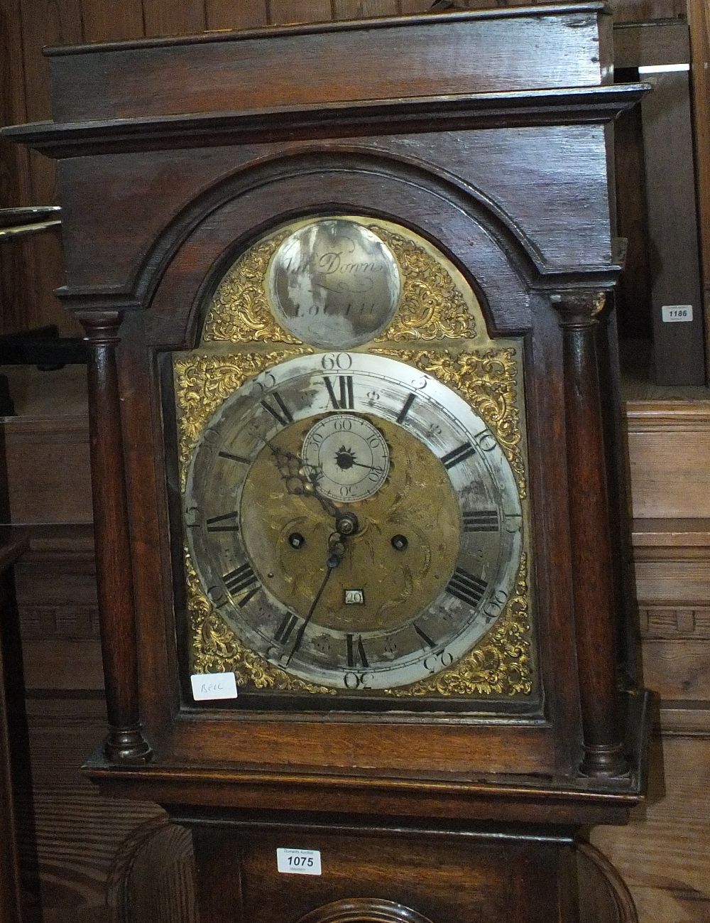 An Oak eight day longcase clock with Brass dial marked Val. Downs ...