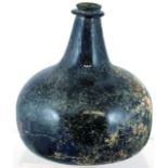 ENGLISH ONION WINE BOTTLE. 6.25ins tall, dark olive glass, applied ...