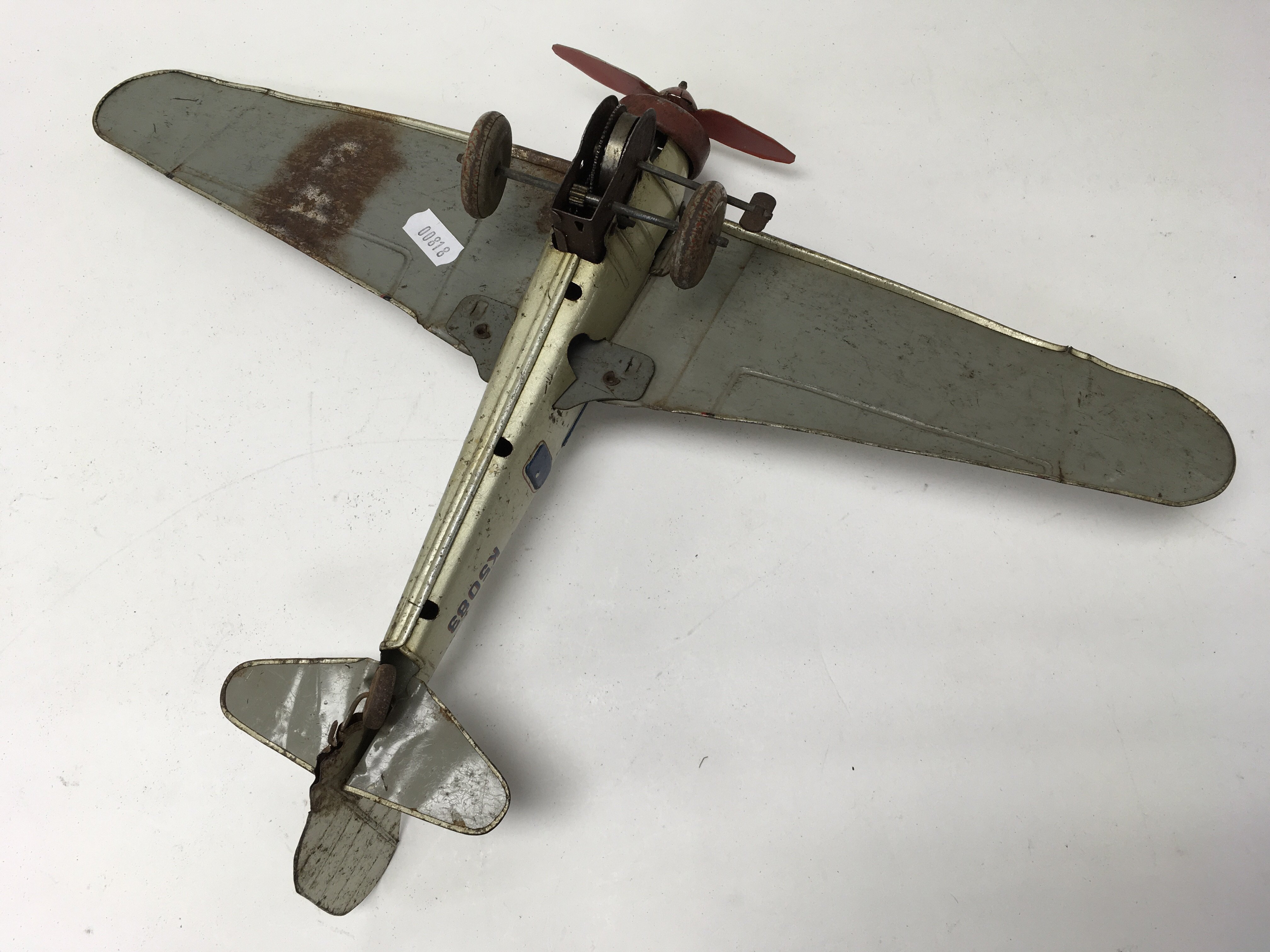 A tin plate clockwork plane.
