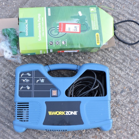 A Workzone portable compressor, together with a submersible pump, boxed