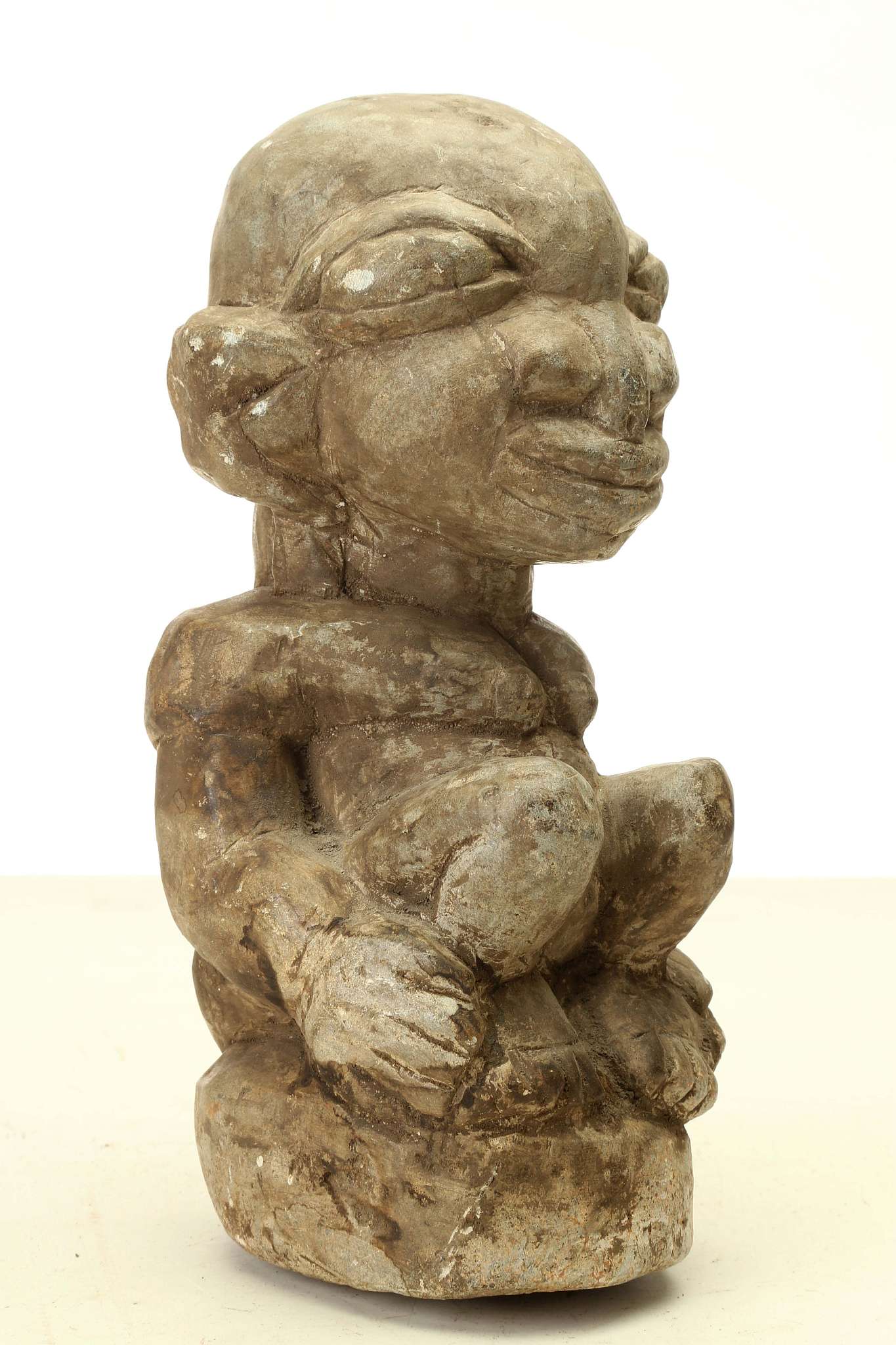 A SAPI-GREBO ‘NOMOLI’ STONE FIGURE, SIERRA LEONE Carved crouching with ...