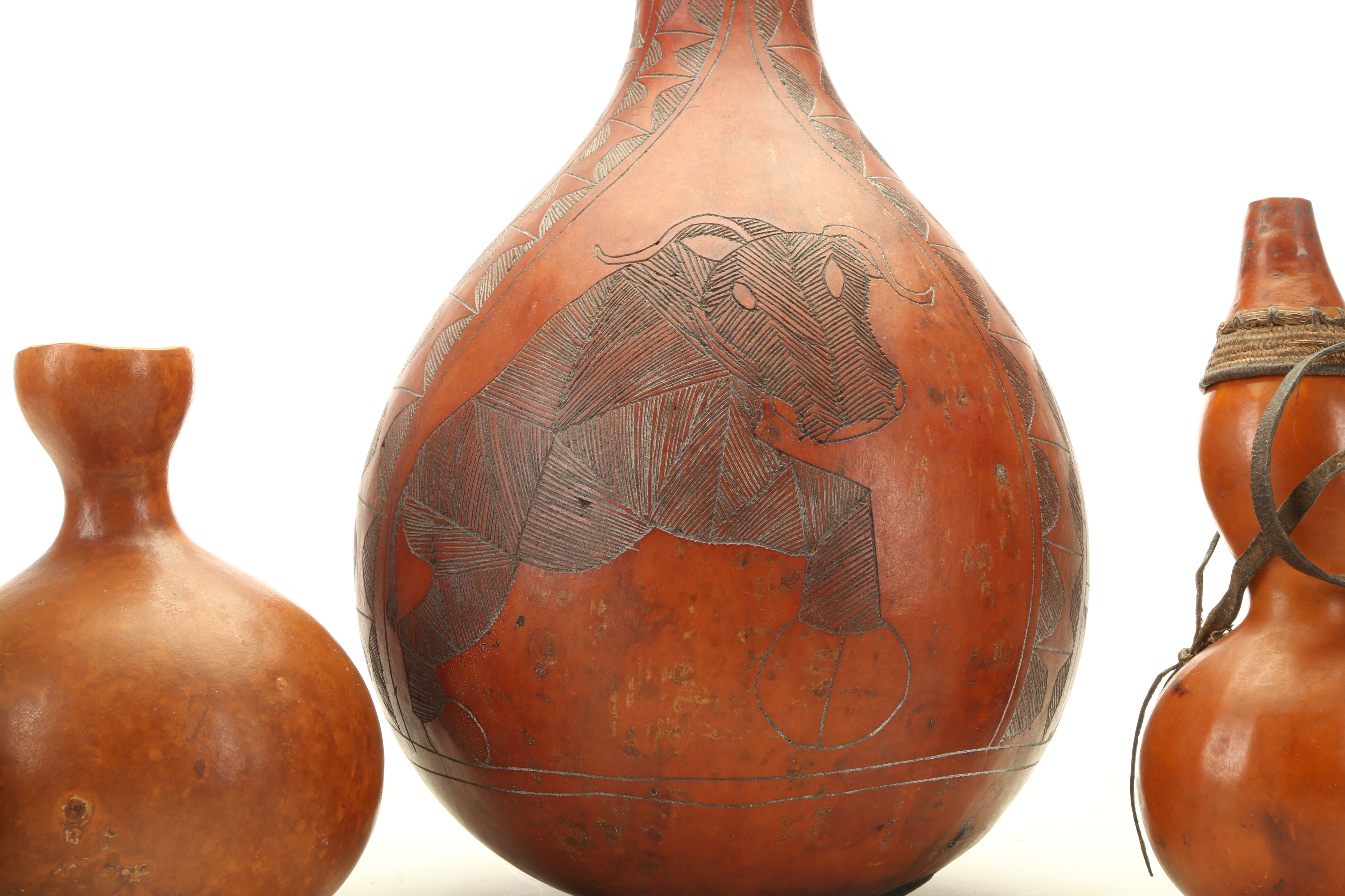 FOUR MASAI GOURD FLASKS, KENYA The largest a Kamba calabash decorated ...