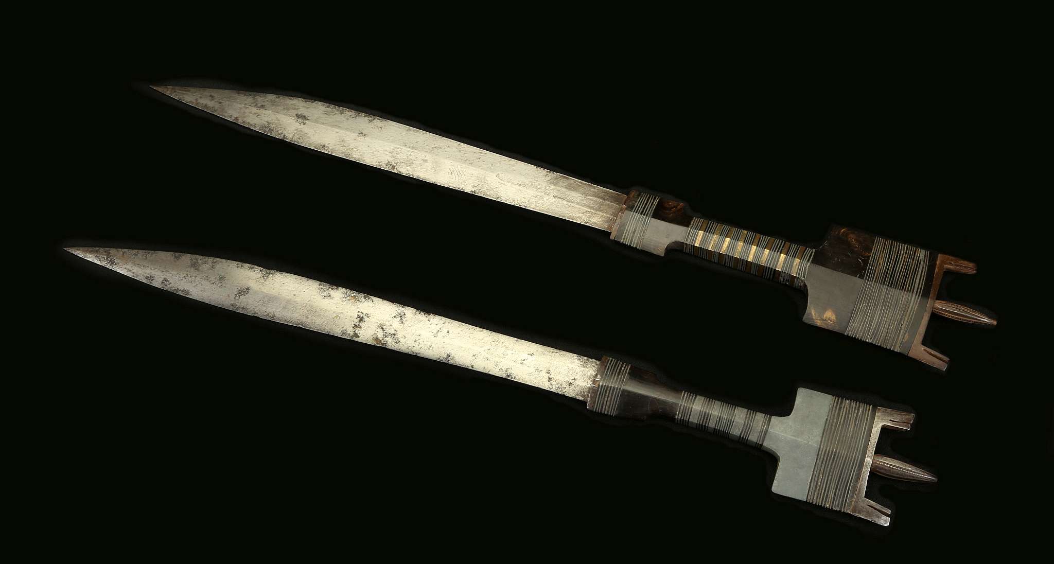 TWO BILLAO SWORDS, SOMALIA With double-edged blade, on a buffalo horn ...